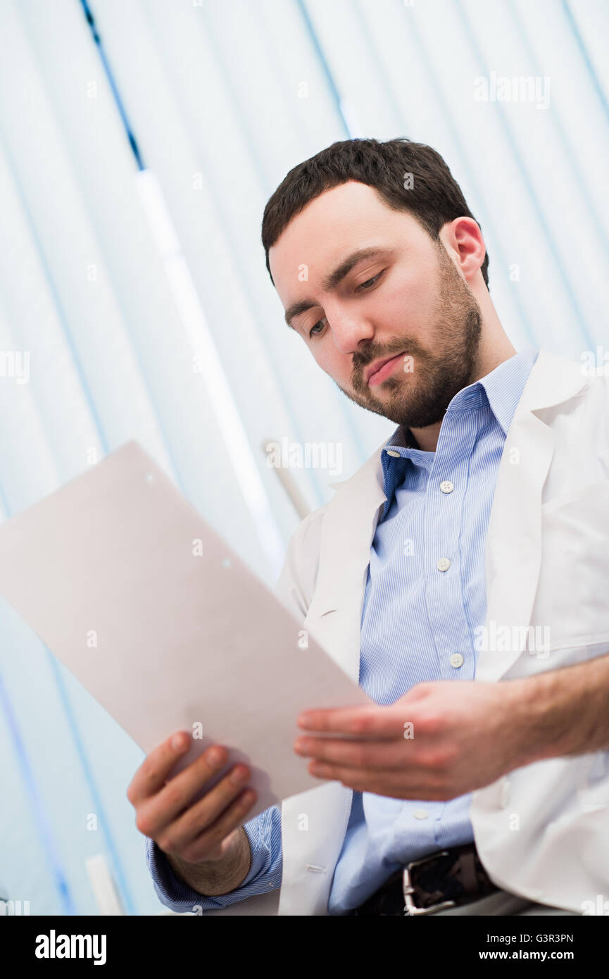 Male medicine doctor hand holding papers. Ward round, patient visit ...