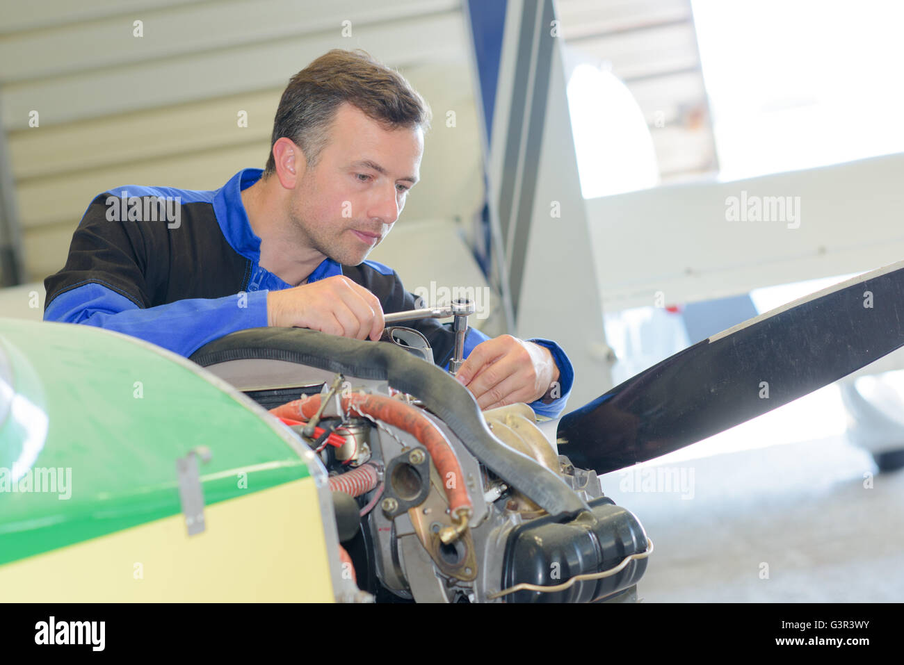 Aviation mechanic working on airplane hi-res stock photography and ...