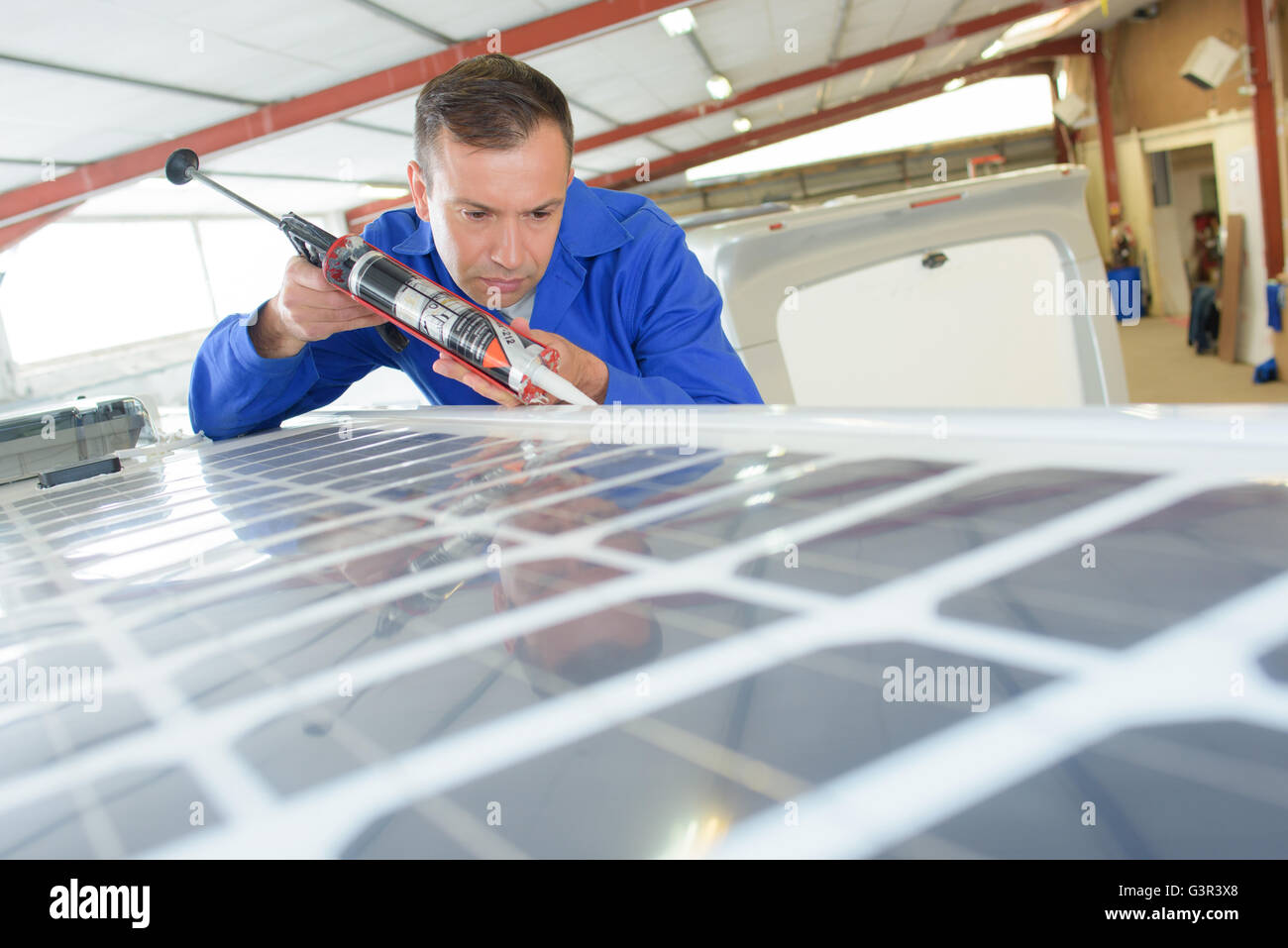 installing solar panel roofing Stock Photo - Alamy