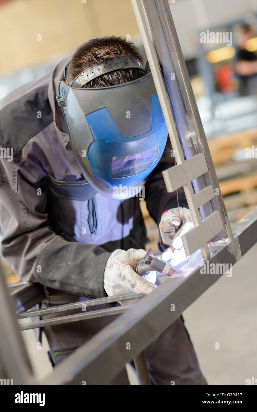 Man welding metal Stock Photo - Alamy