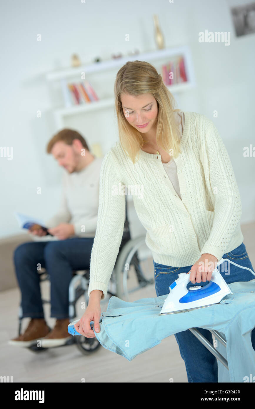 Woman doing some ironing Stock Photo - Alamy