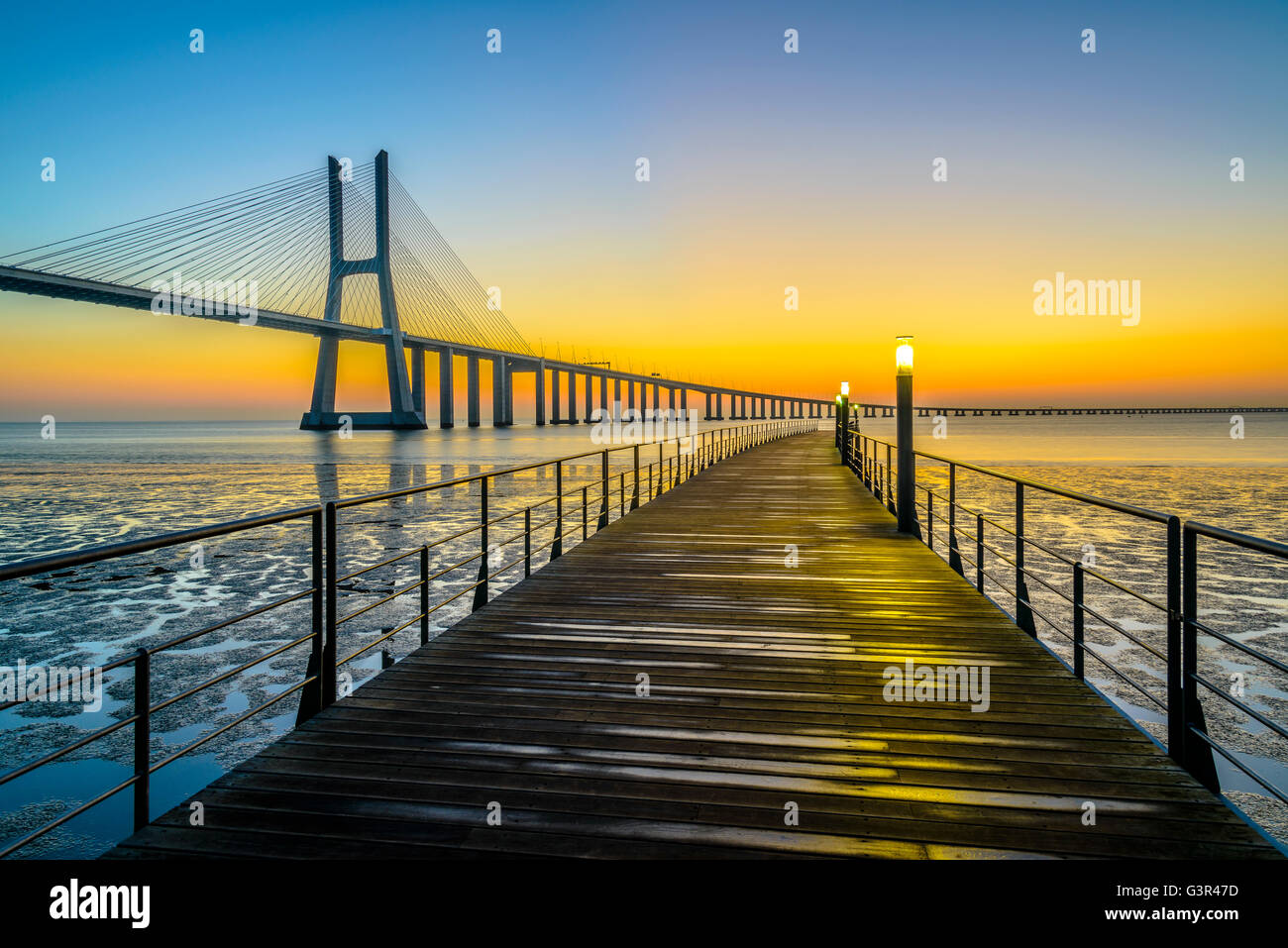 Vasco da Gama Bridge at sunrise, Lisbon, Portugal Stock Photo - Alamy