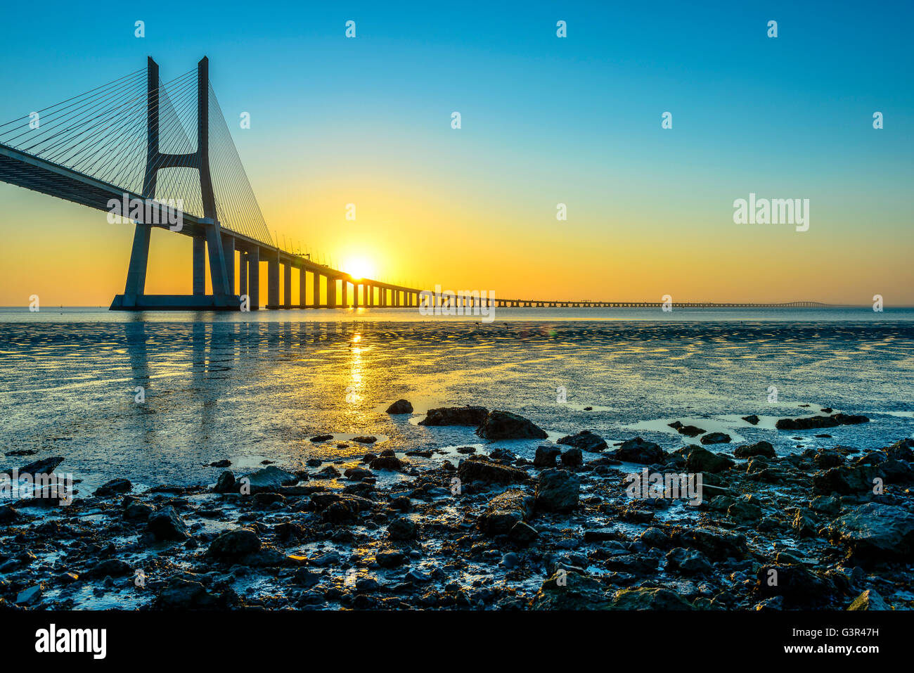 Vasco da Gama Bridge at sunrise, Lisbon, Portugal Stock Photo - Alamy