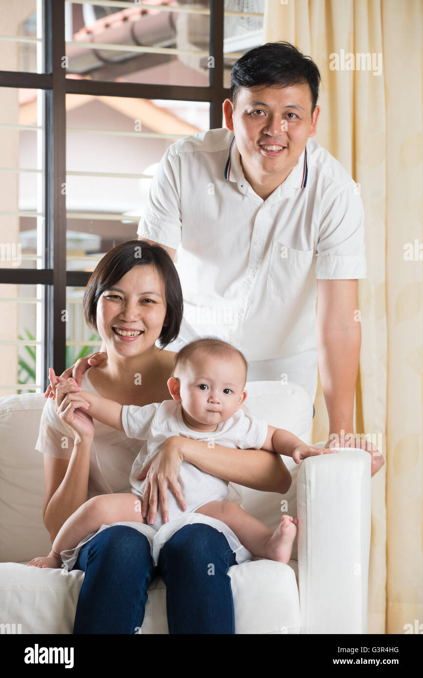 Happy Asian Family Playing with baby in the living room Stock Photo - Alamy