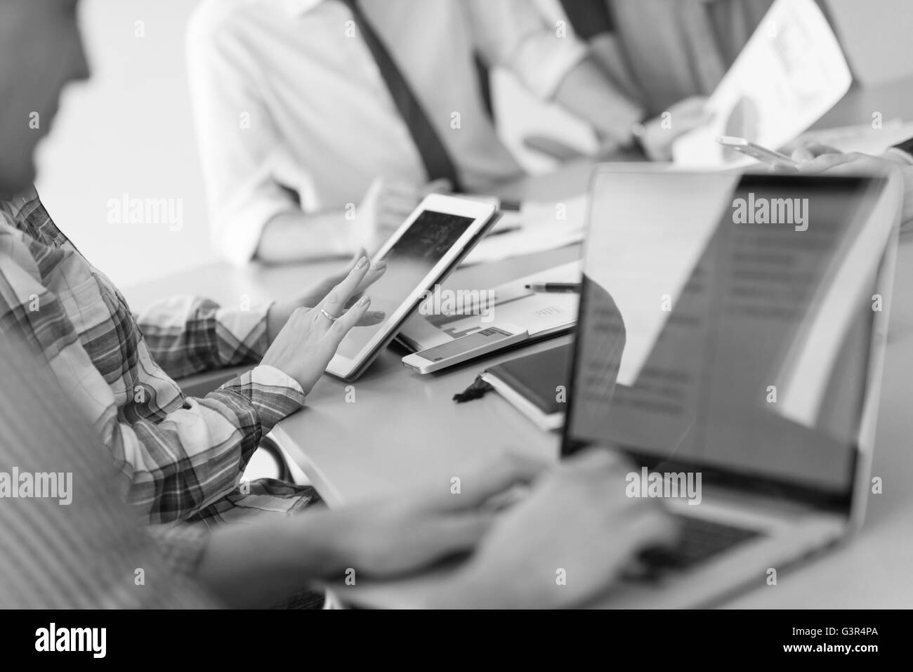 close up of business man hands typing on laptop computer at modern ...