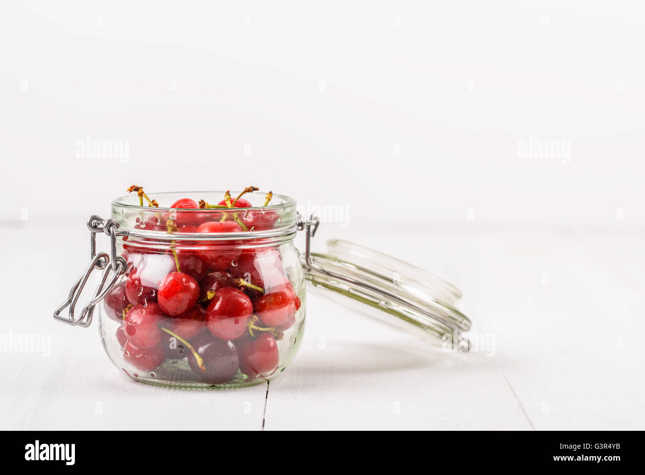 Jar Of Red Fresh Cherries Stock Photo - Alamy