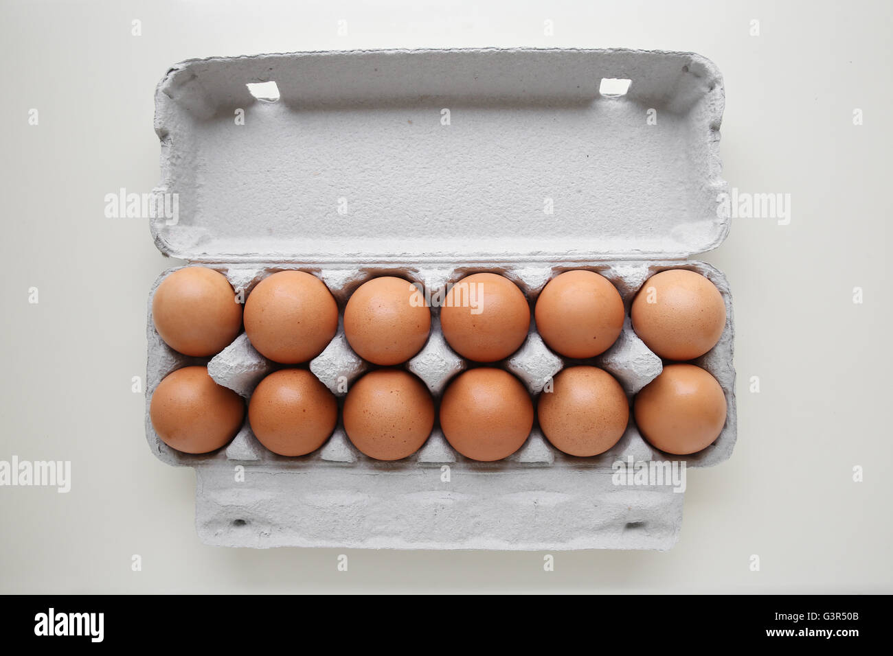 Dozen eggs in packaging Stock Photo - Alamy