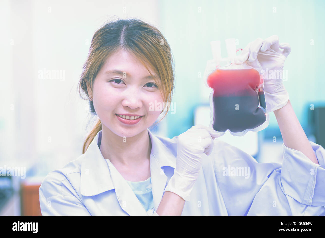 Bag of Blood in hand asian woman Doctor Stock Photo - Alamy