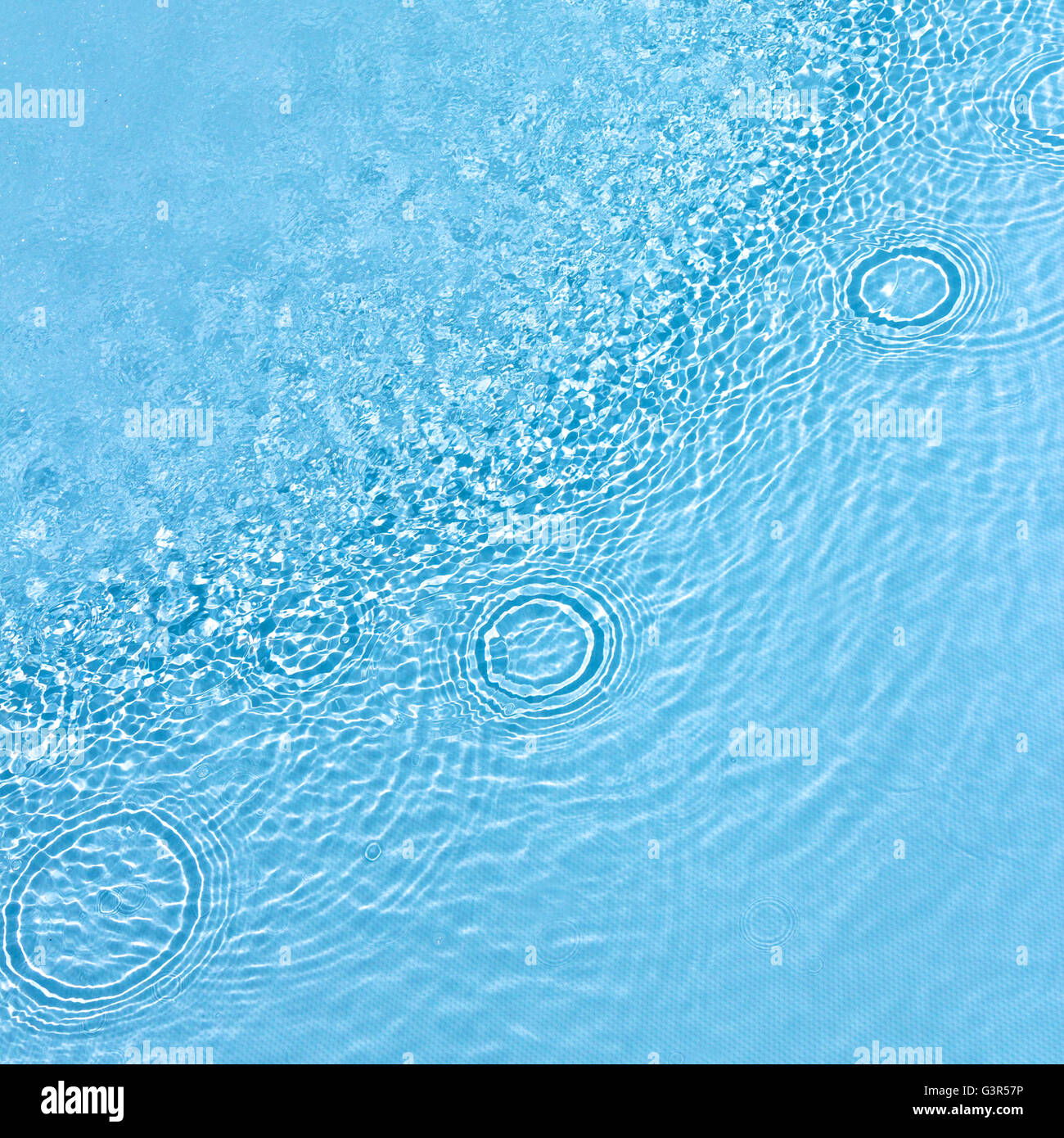 Water surface in the pool with raindrops Stock Photo - Alamy