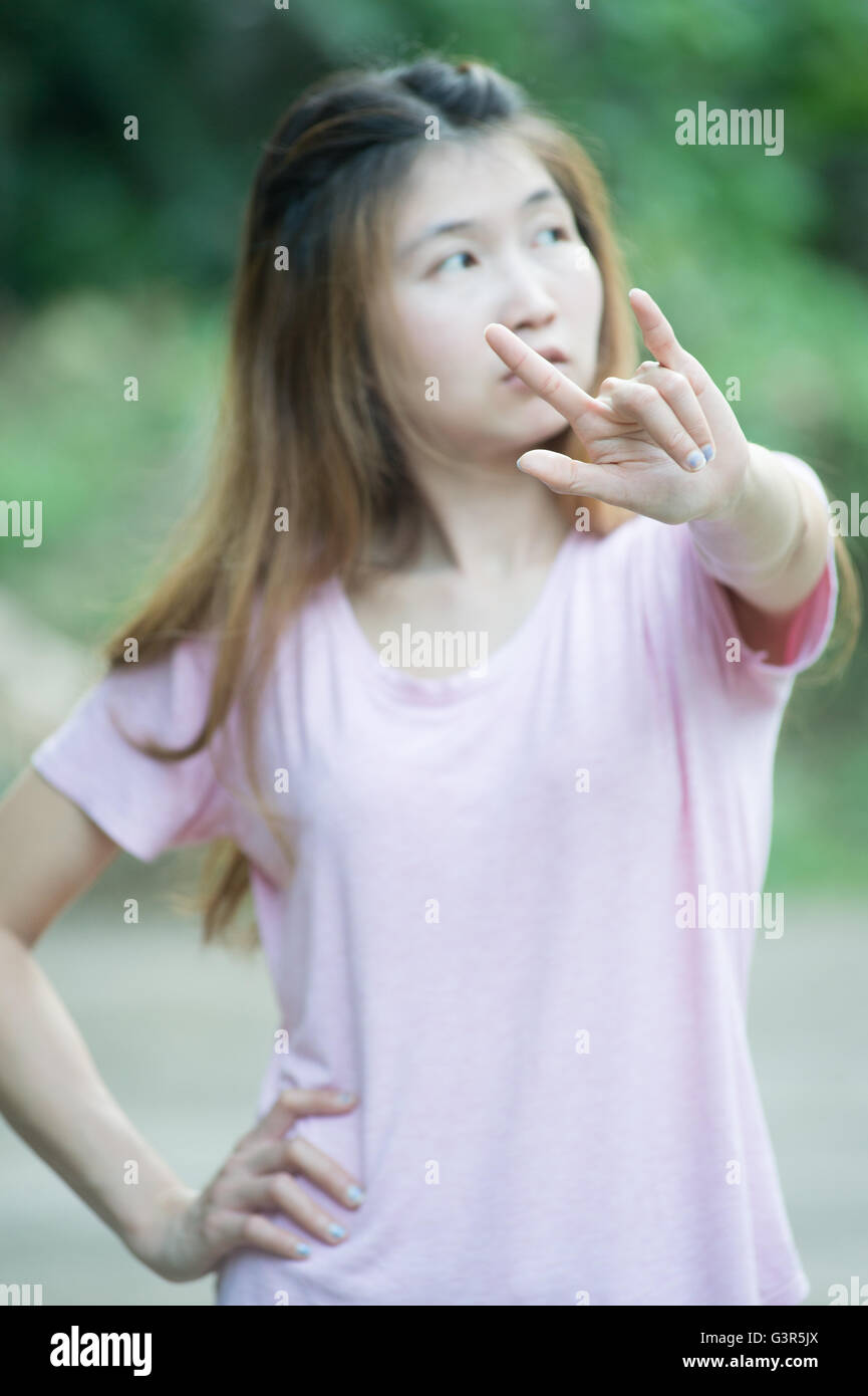 asia beautiful young woman show one hand love sign Stock Photo - Alamy