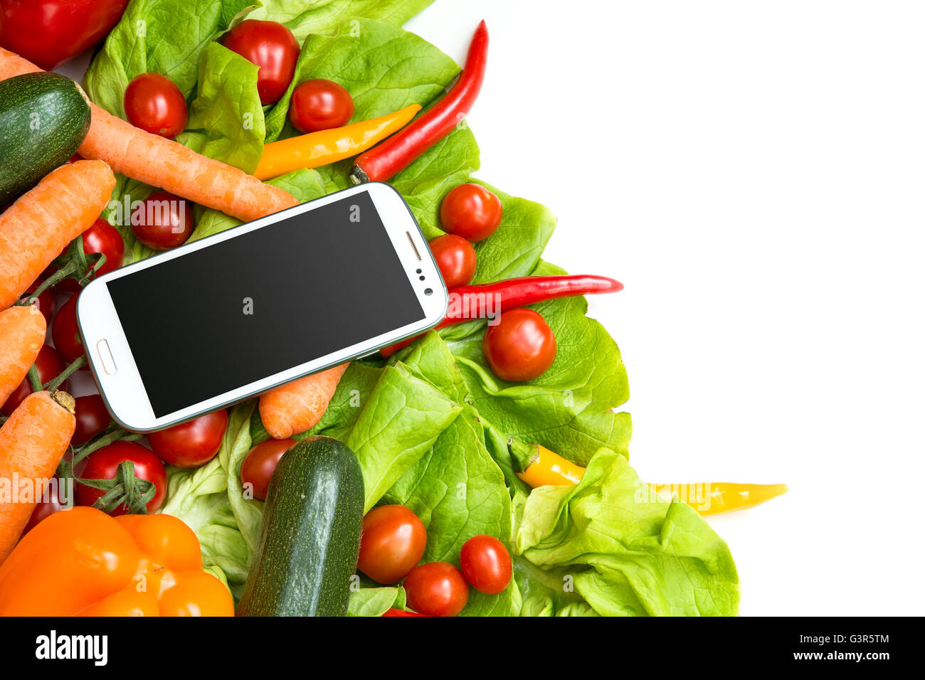 Various vegetables with a Smartphone Stock Photo - Alamy