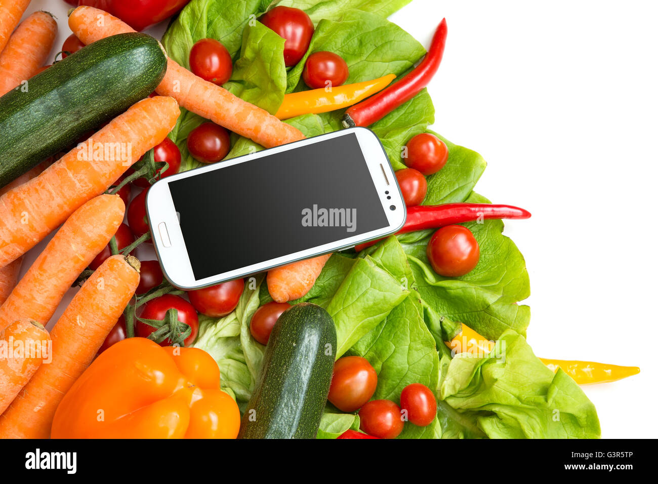 Various vegetables with a Smartphone Stock Photo - Alamy