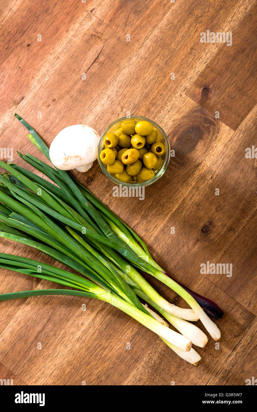 Organic leek on a wooden kitchen Table Stock Photo - Alamy