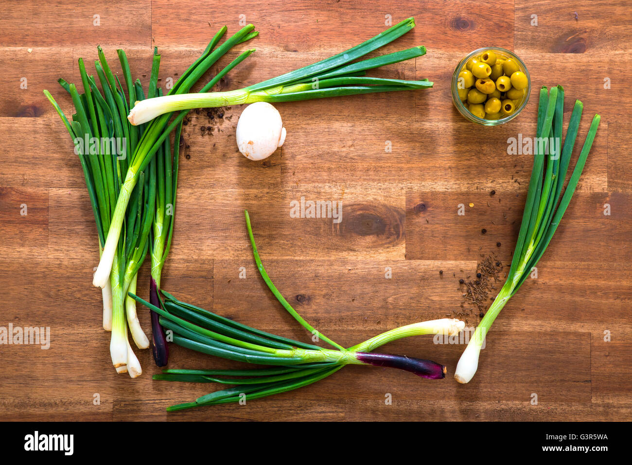 Organic leek on a wooden kitchen Table Stock Photo - Alamy