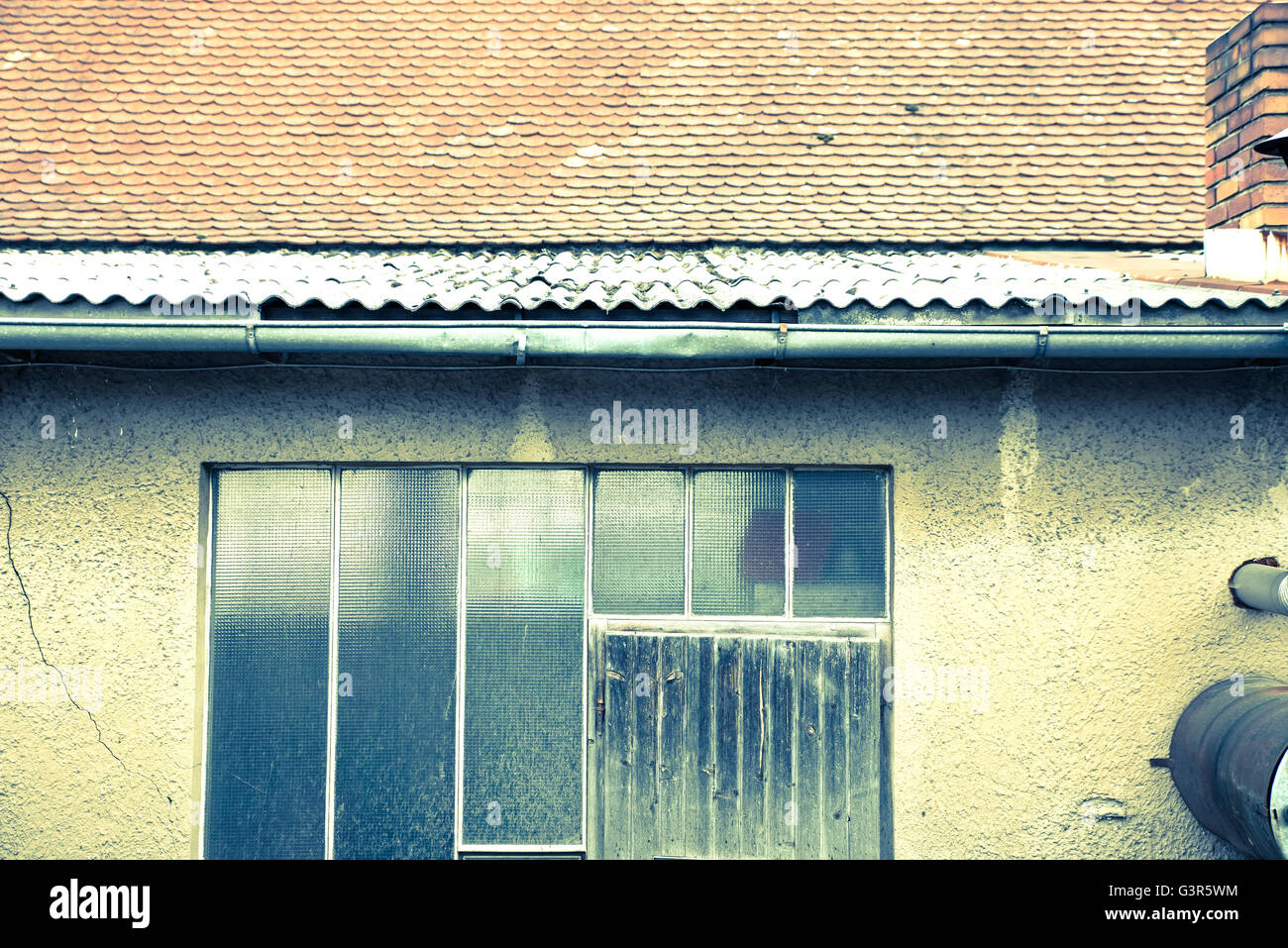 A exterior of a old and abandoned industrial building Stock Photo - Alamy