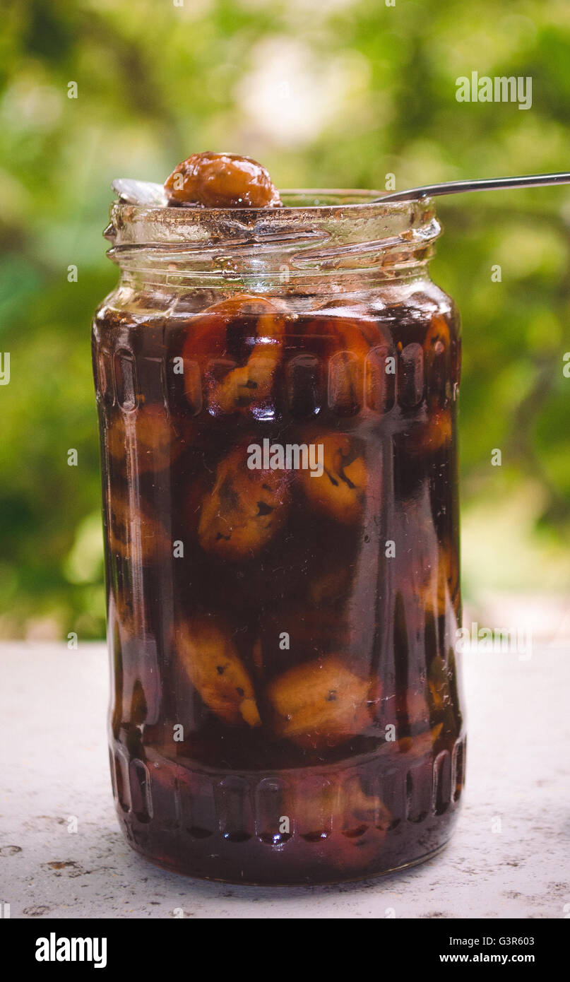 Green walnut jam Stock Photo - Alamy