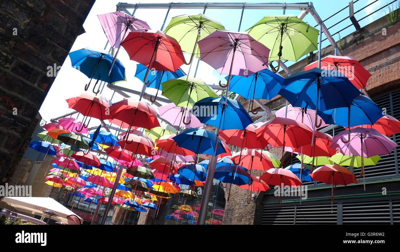 Brightly coloured umbrellas,parasols on display in courtyard Stock ...