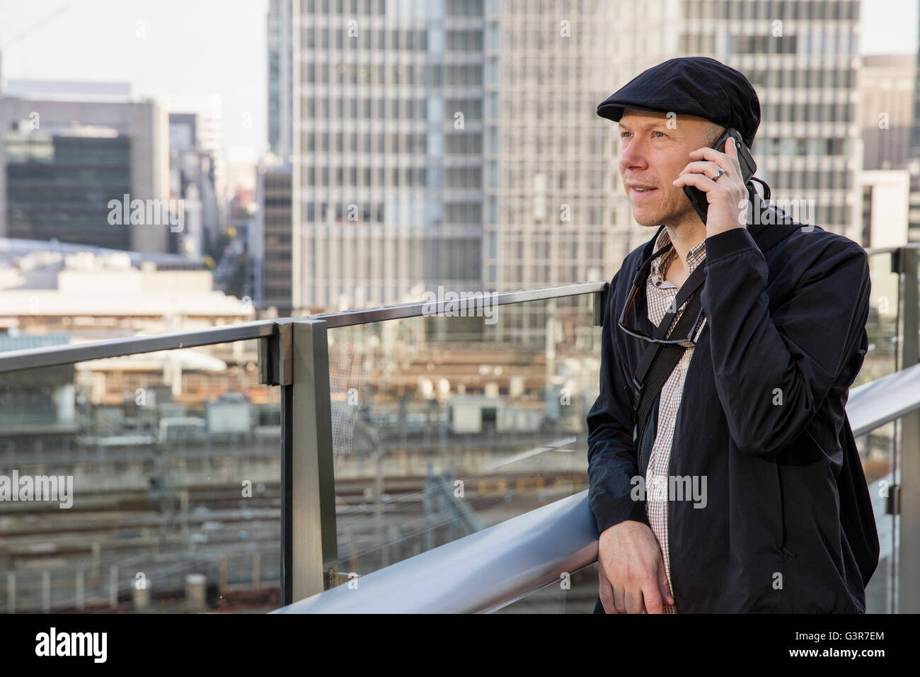 Man leaning against balustrade hi-res stock photography and images - Alamy