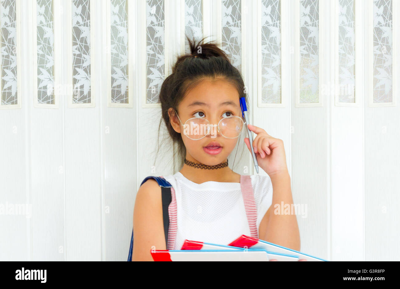 cute girl thinking ,girl cute reading book Stock Photo - Alamy