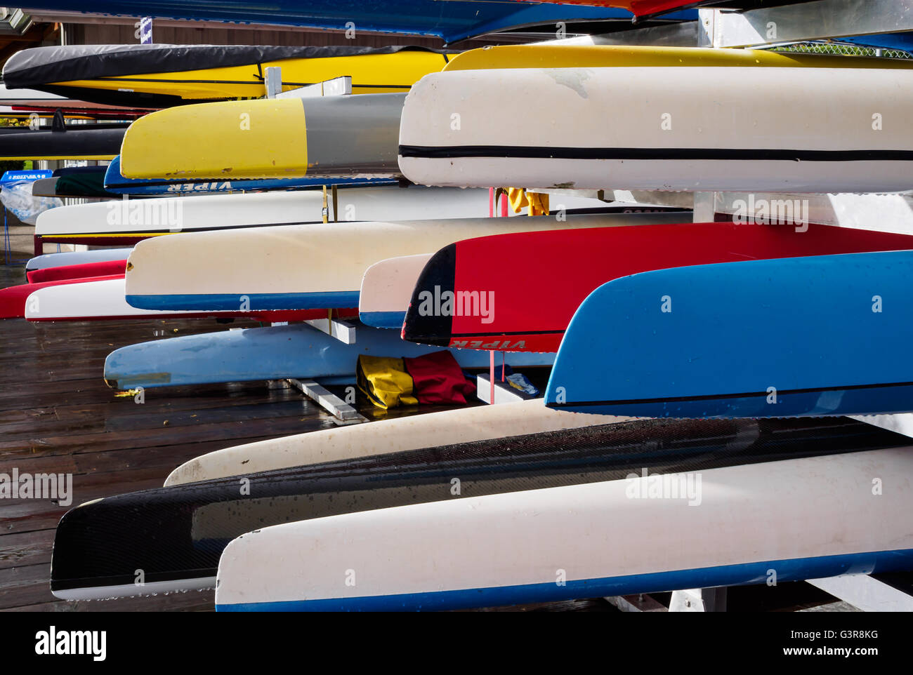 Rowing shell stacked in a rack Stock Photo - Alamy