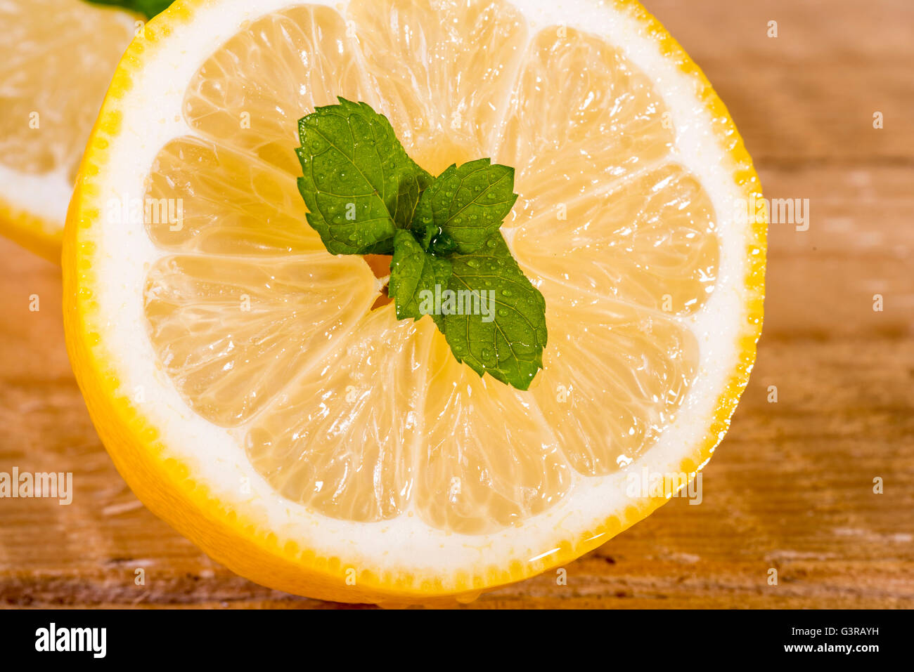 photo of half a lemon with fresh mint Stock Photo - Alamy