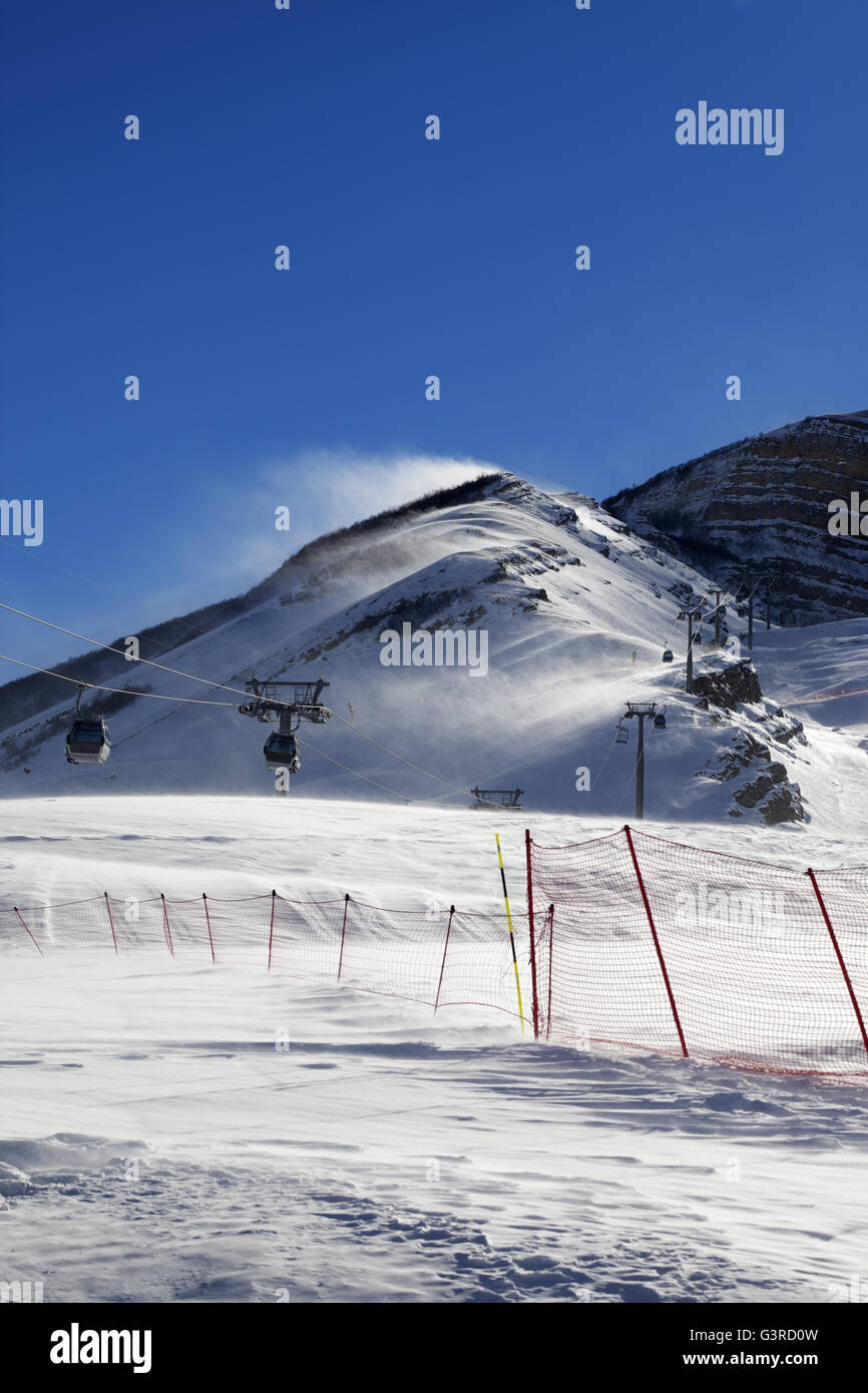 Gondola lift on ski resort at windy sun day. Greater Caucasus, Mount ...