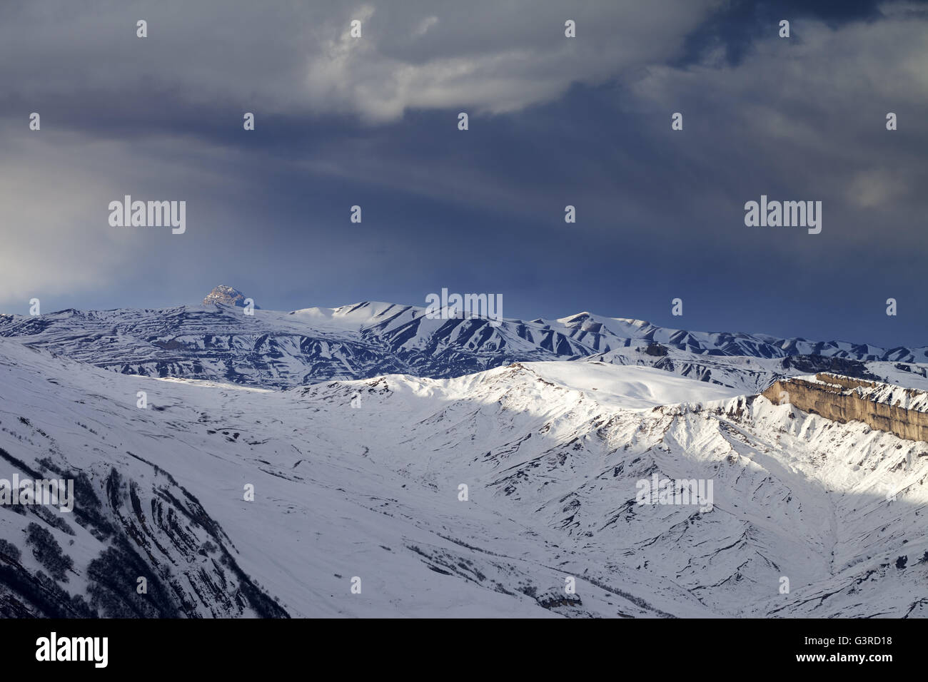 Winter mountains at evening and storm clouds. Greater Caucasus, Mount ...
