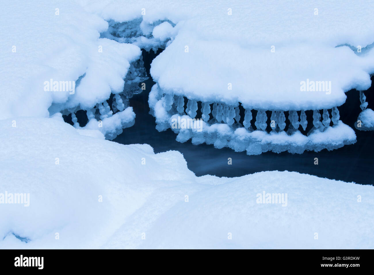 Frozen waterfall with blue ice in winter Stock Photo - Alamy