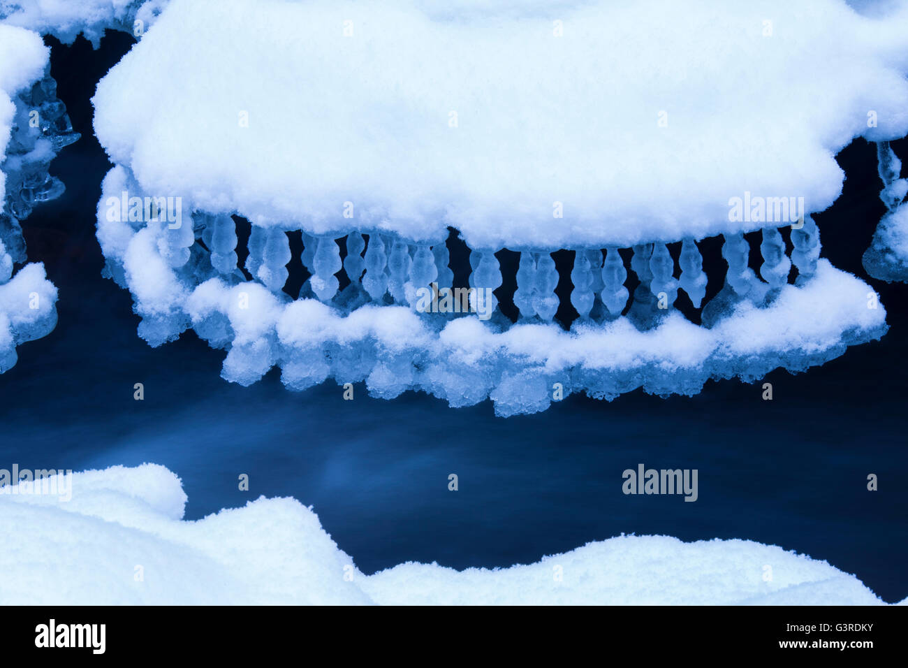 Frozen waterfall with blue ice in winter Stock Photo - Alamy