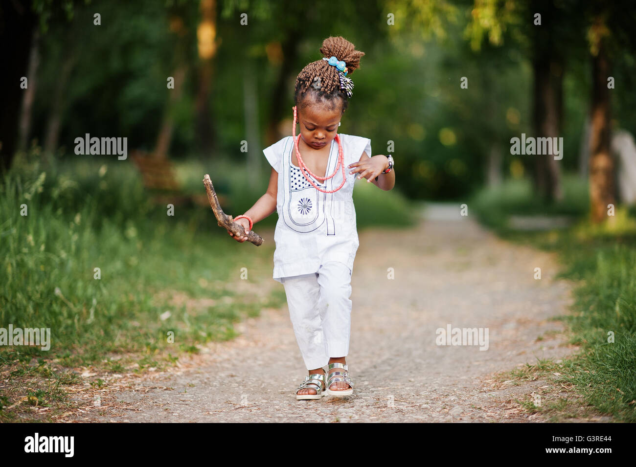 African baby girl walking at park Stock Photo - Alamy