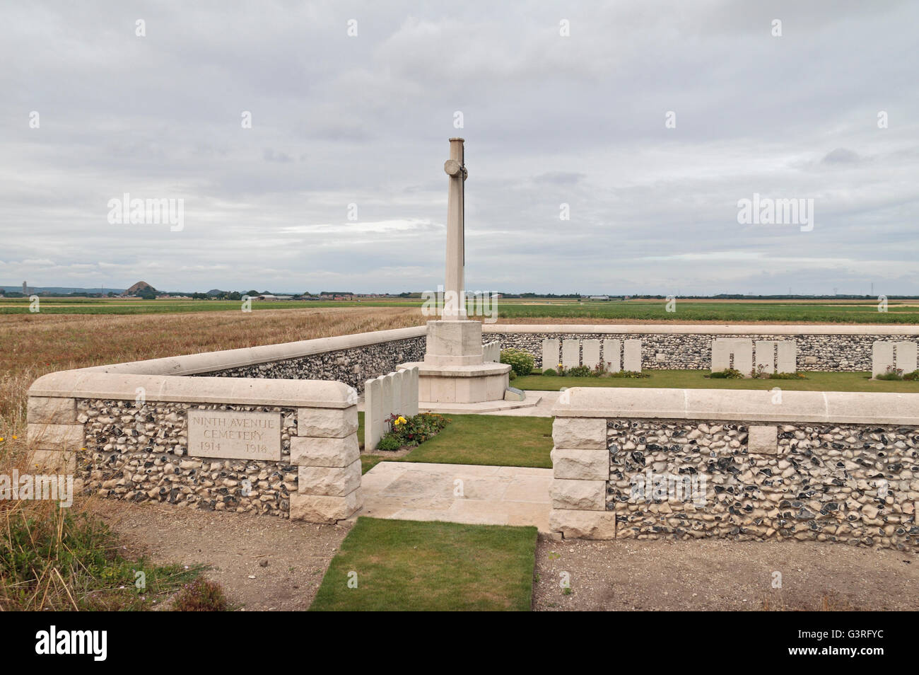 Cross of Sacrifice and headstones in the CWGC Ninth Avenue Cemetery ...