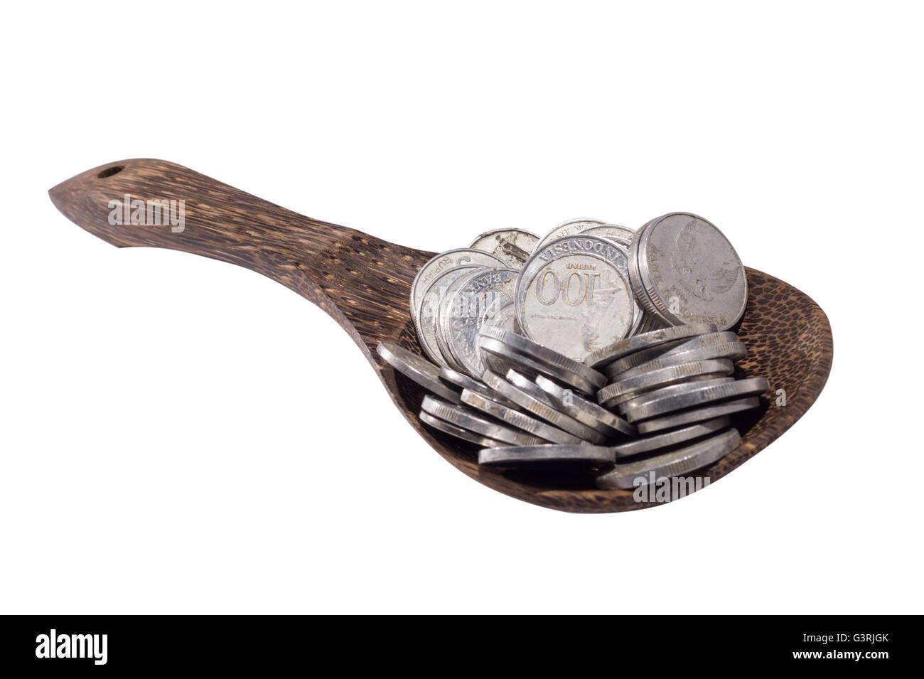 Isolated Stack of Coin on wooden spoon on White Background Stock Photo ...