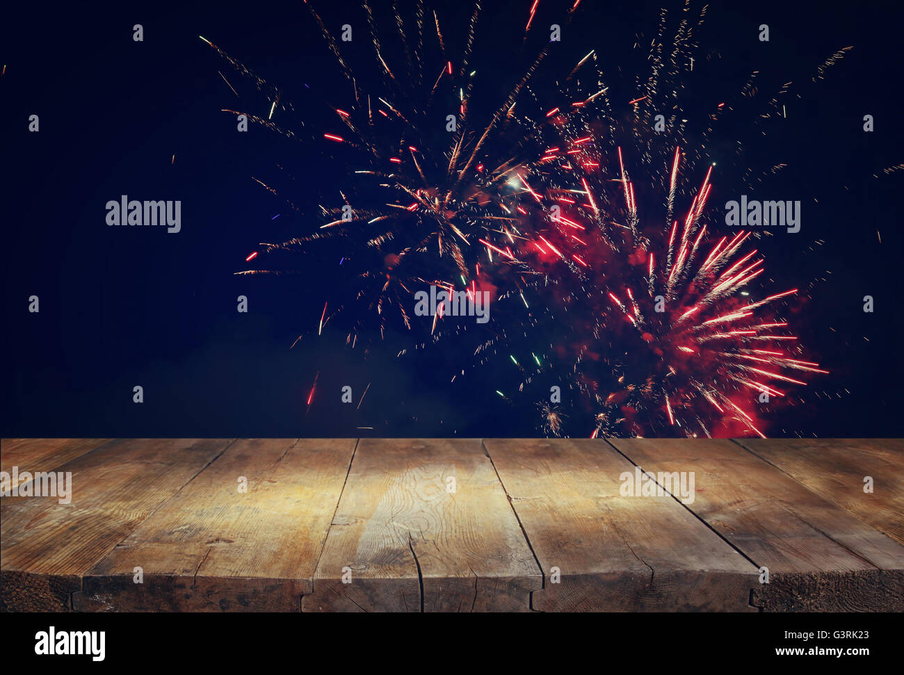 image of wooden table in front of blurred fireworks background Stock ...