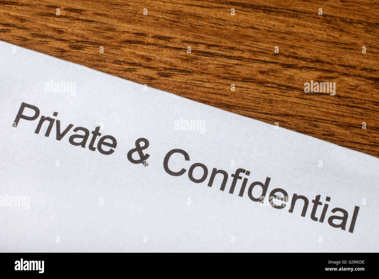 Private and Confidential printed on a piece of paper Stock Photo - Alamy
