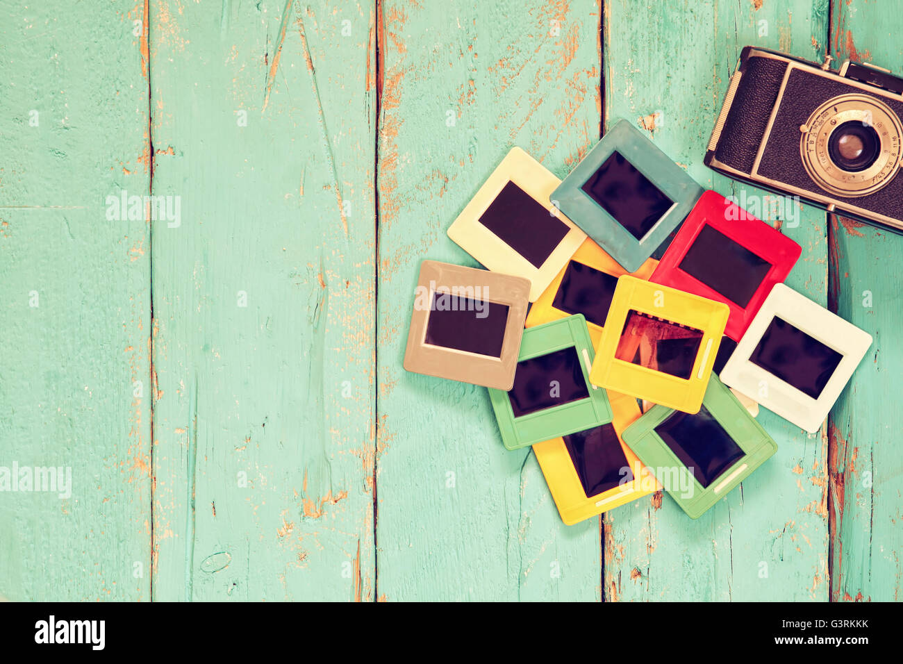 top view of old slides frames over wooden blue background. vintage ...