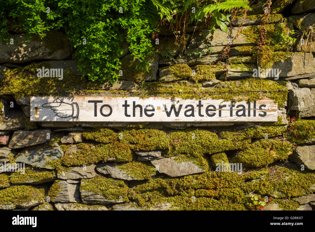 A sign pointing to the direction of Stock Ghyll Force waterfall in ...