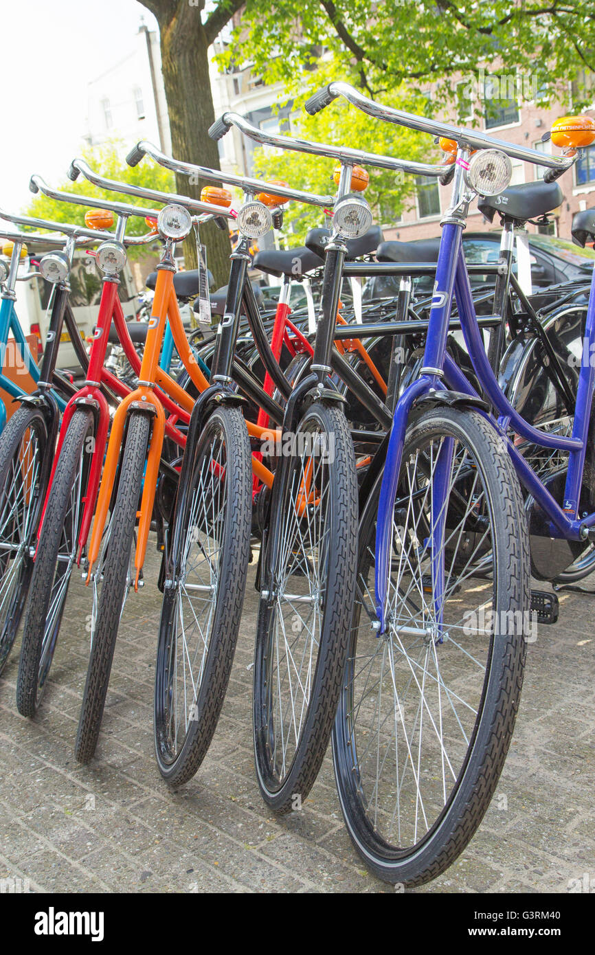 Color bicycles lined up in a row. (Amsterdam, Netherlands Stock Photo ...