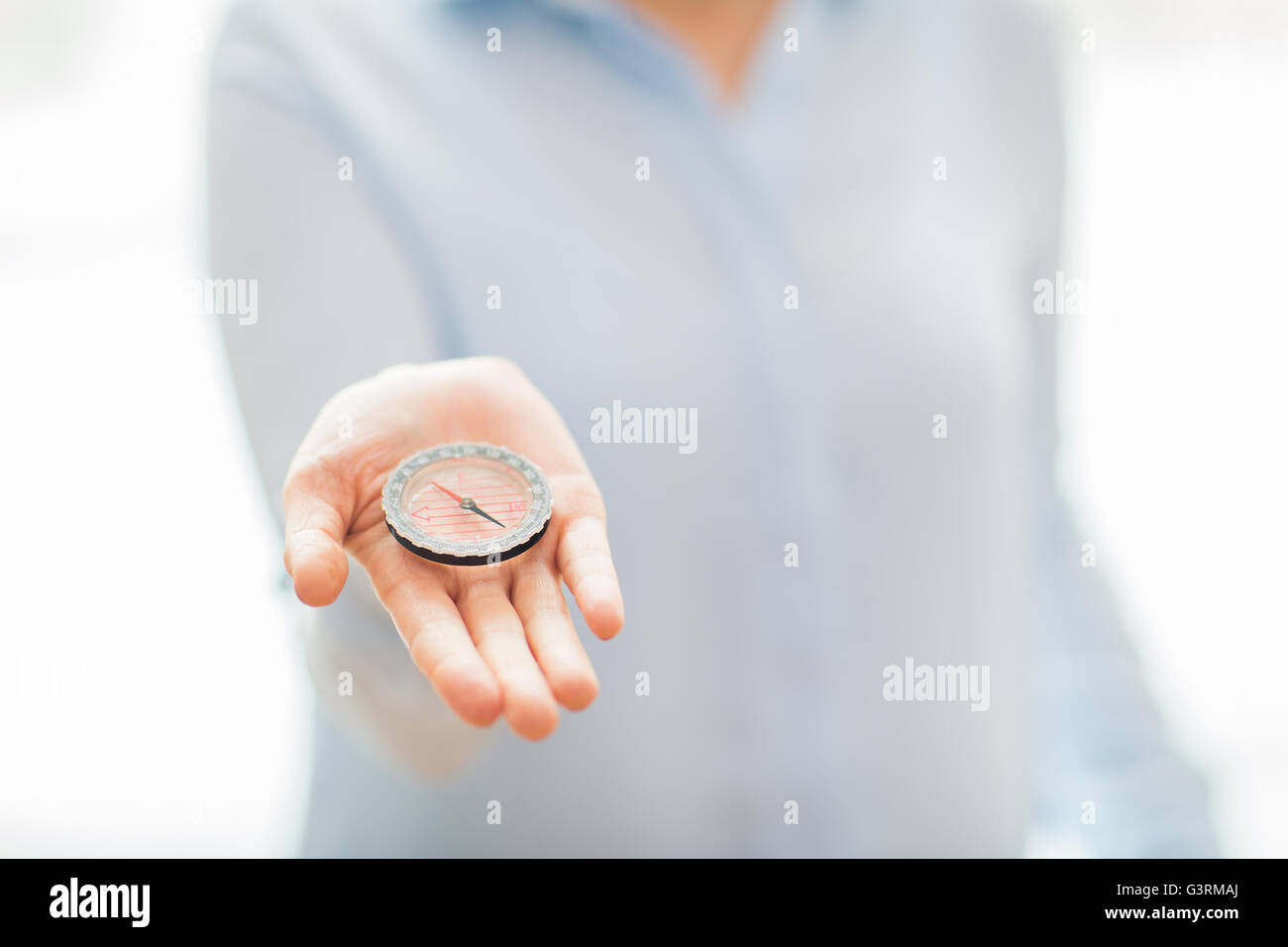 close up of woman hand holding compass Stock Photo - Alamy