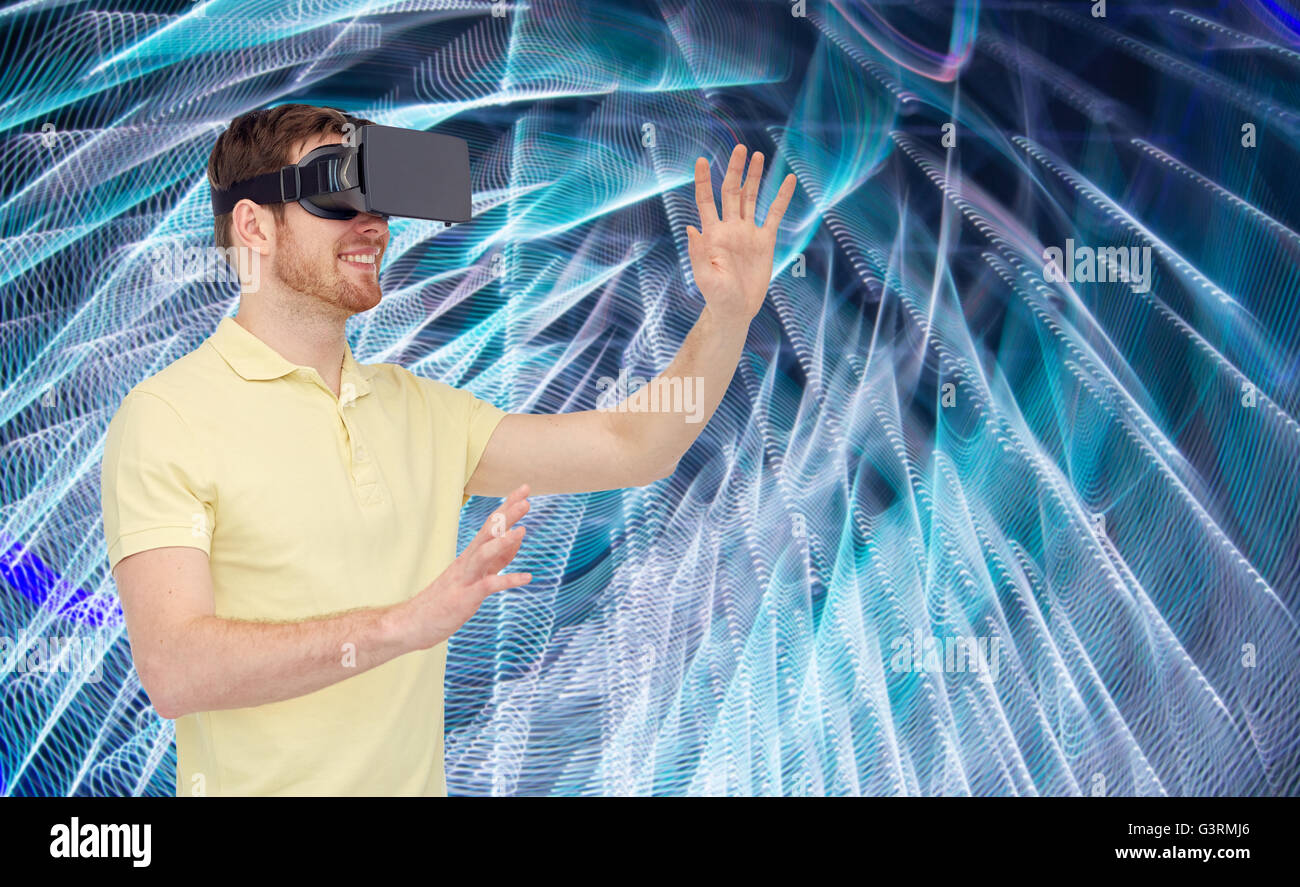 happy man in virtual reality headset or 3d glasses Stock Photo - Alamy