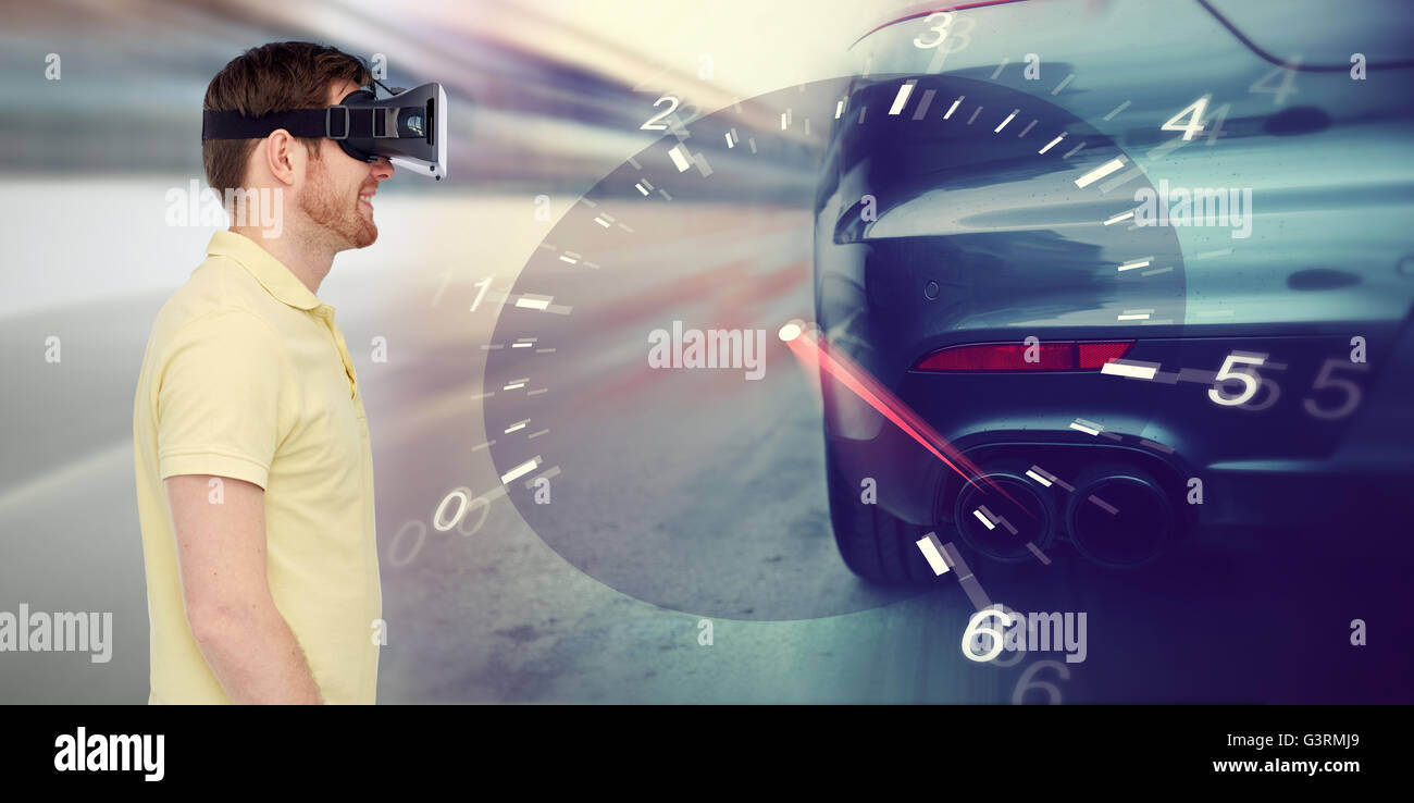 man in virtual reality headset and car racing game Stock Photo - Alamy