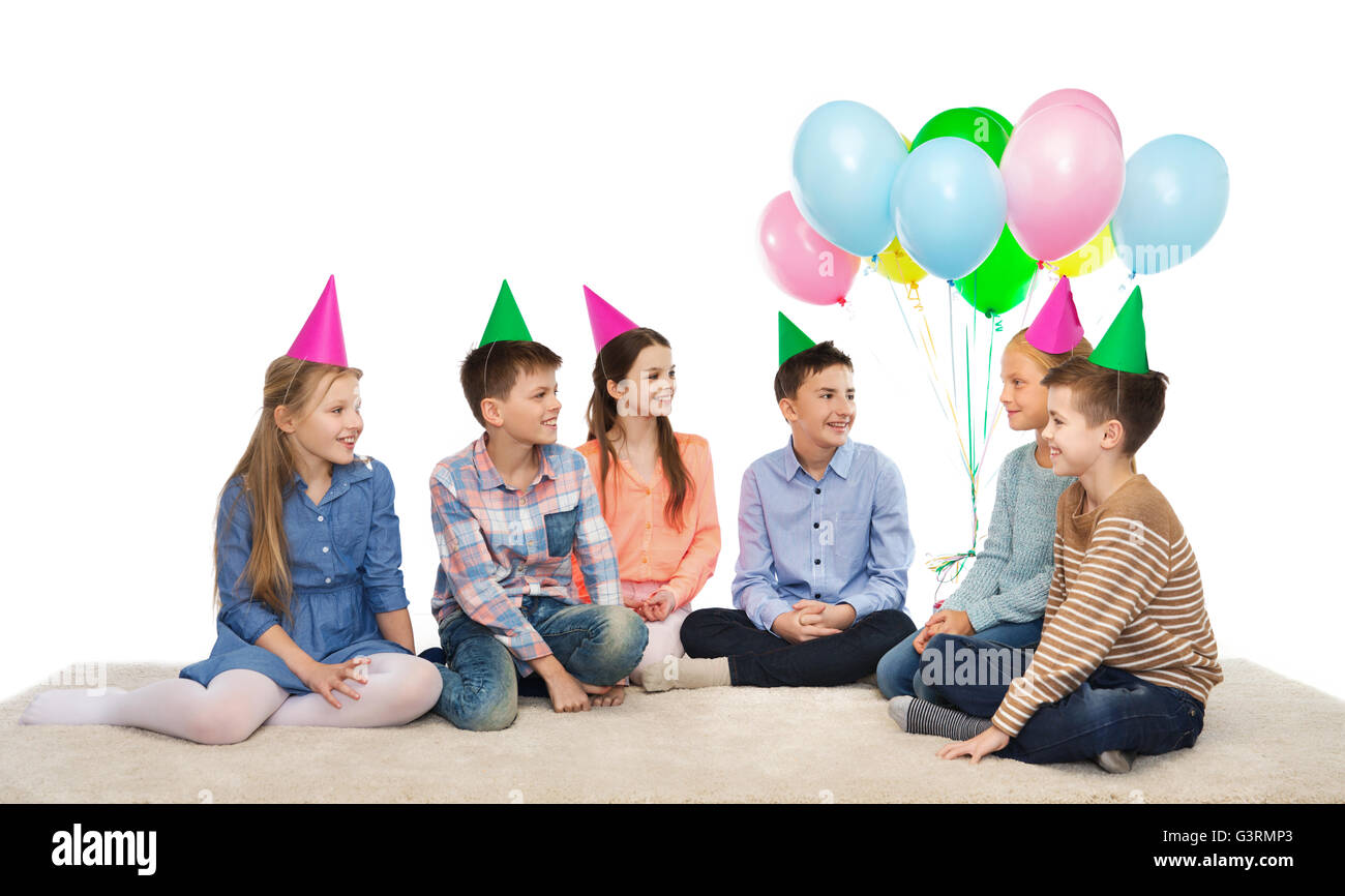happy smiling children in party hats on birthday Stock Photo - Alamy