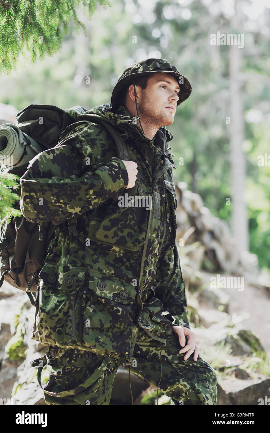 young soldier with backpack in forest Stock Photo - Alamy