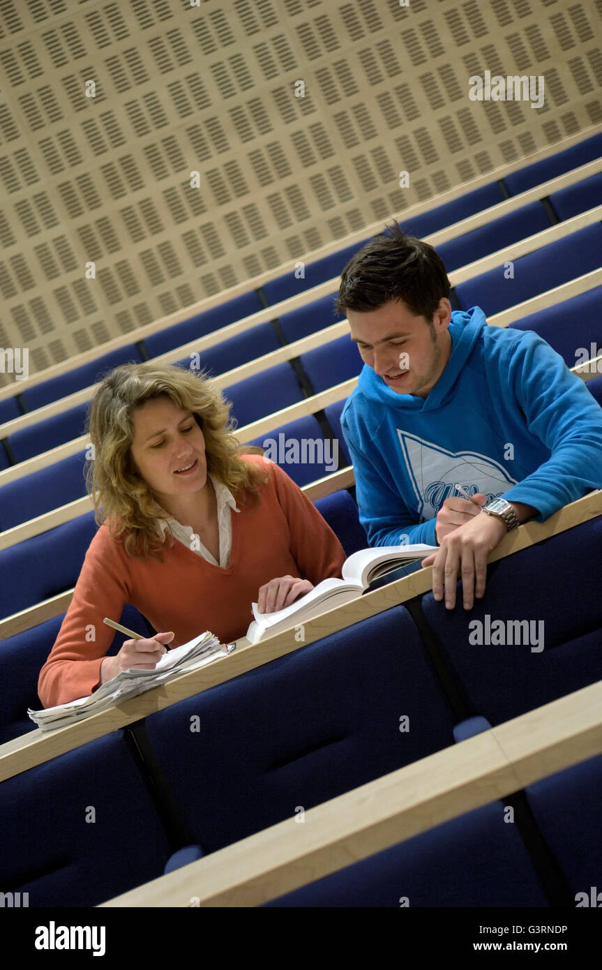 Two students studying in the lecture theatre. England. UK Stock Photo ...