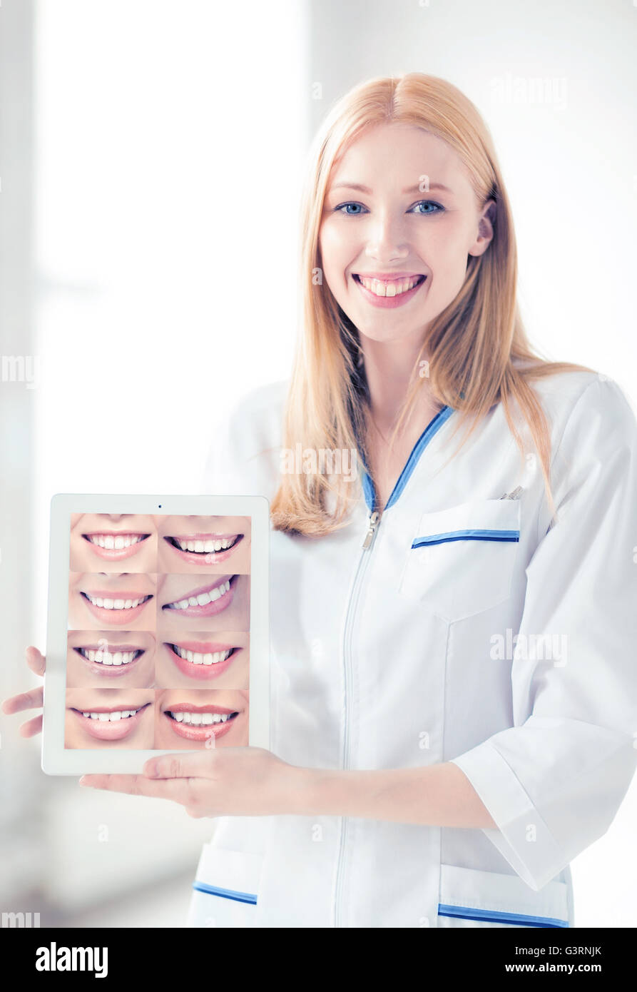 Attractive female doctor smiles hi-res stock photography and images - Alamy