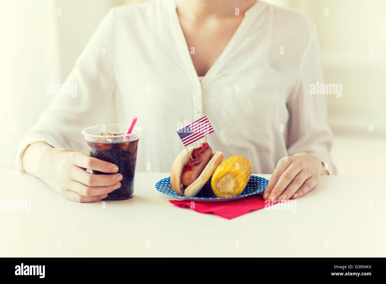 Woman eating corn dog hi-res stock photography and images - Alamy