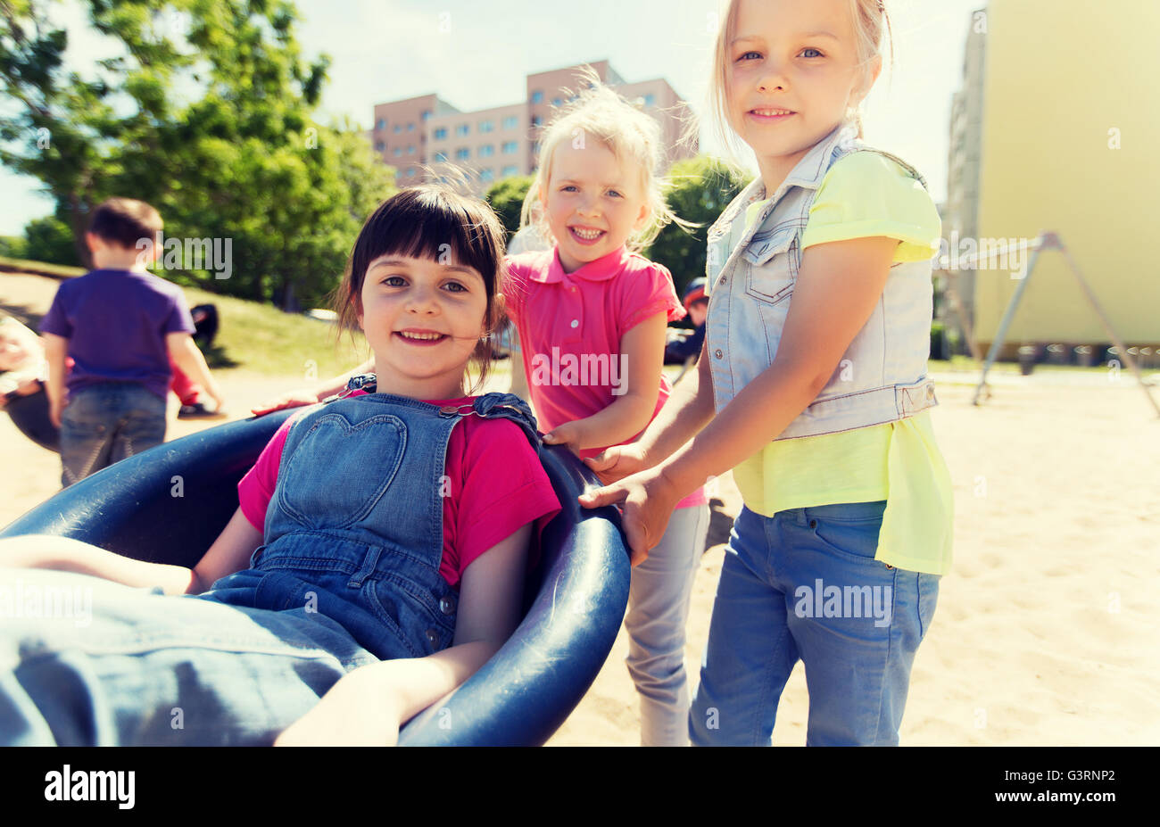 happy kids on children playground Stock Photo - Alamy