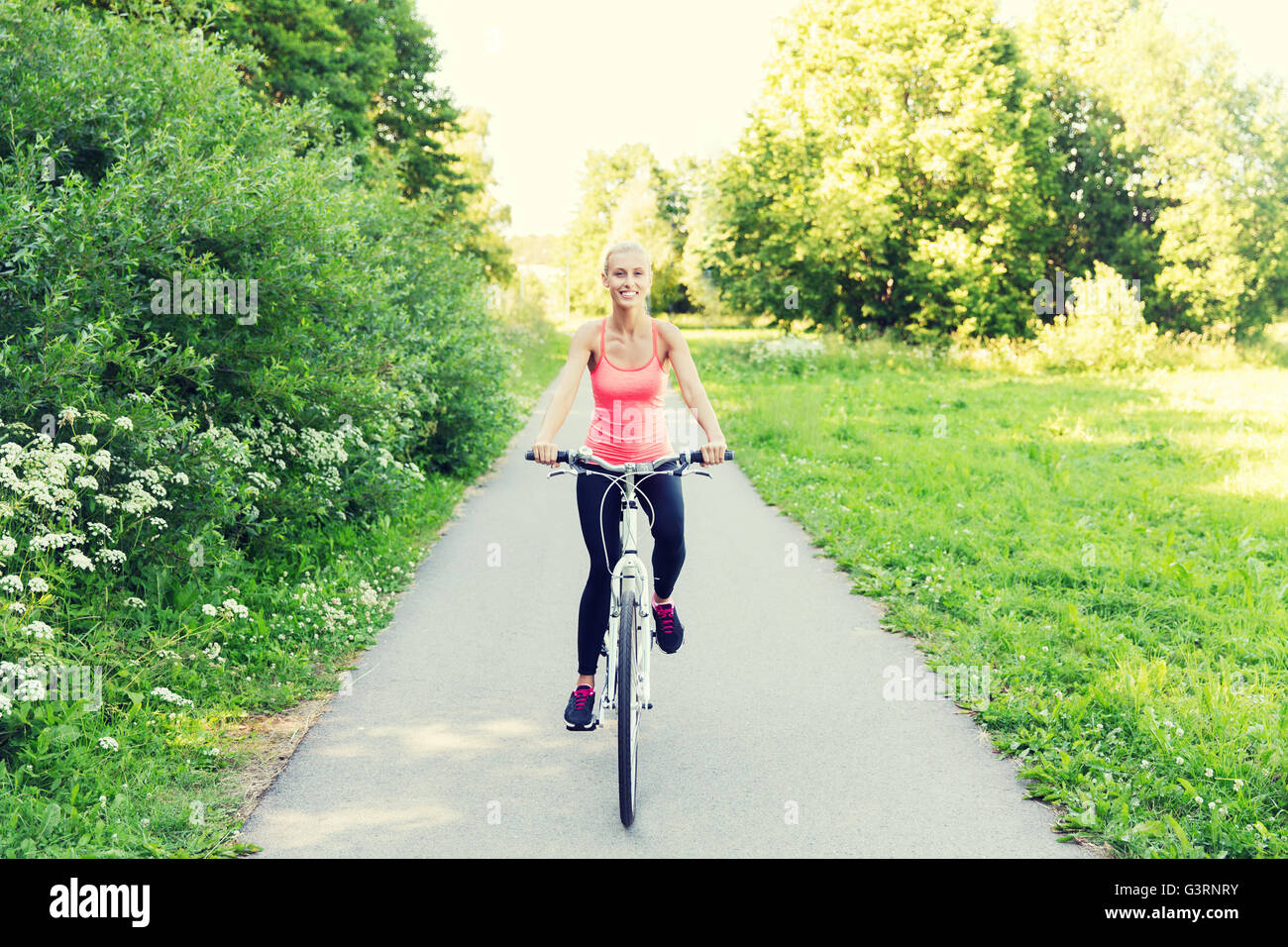 Sportive young woman bicycle nature hi-res stock photography and images ...