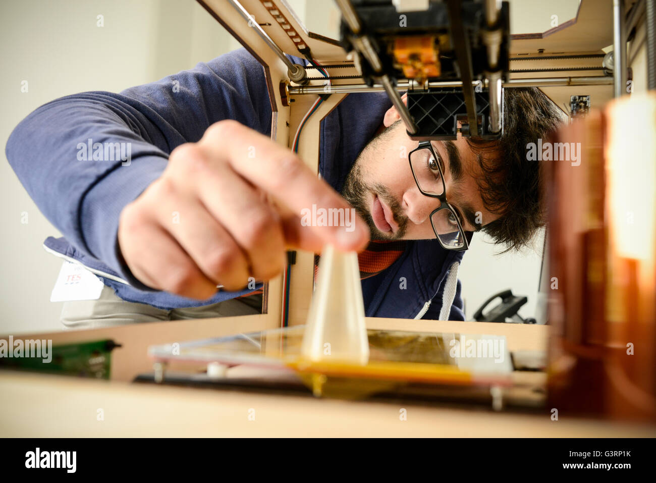Student using 3D printer in technology lab Stock Photo - Alamy