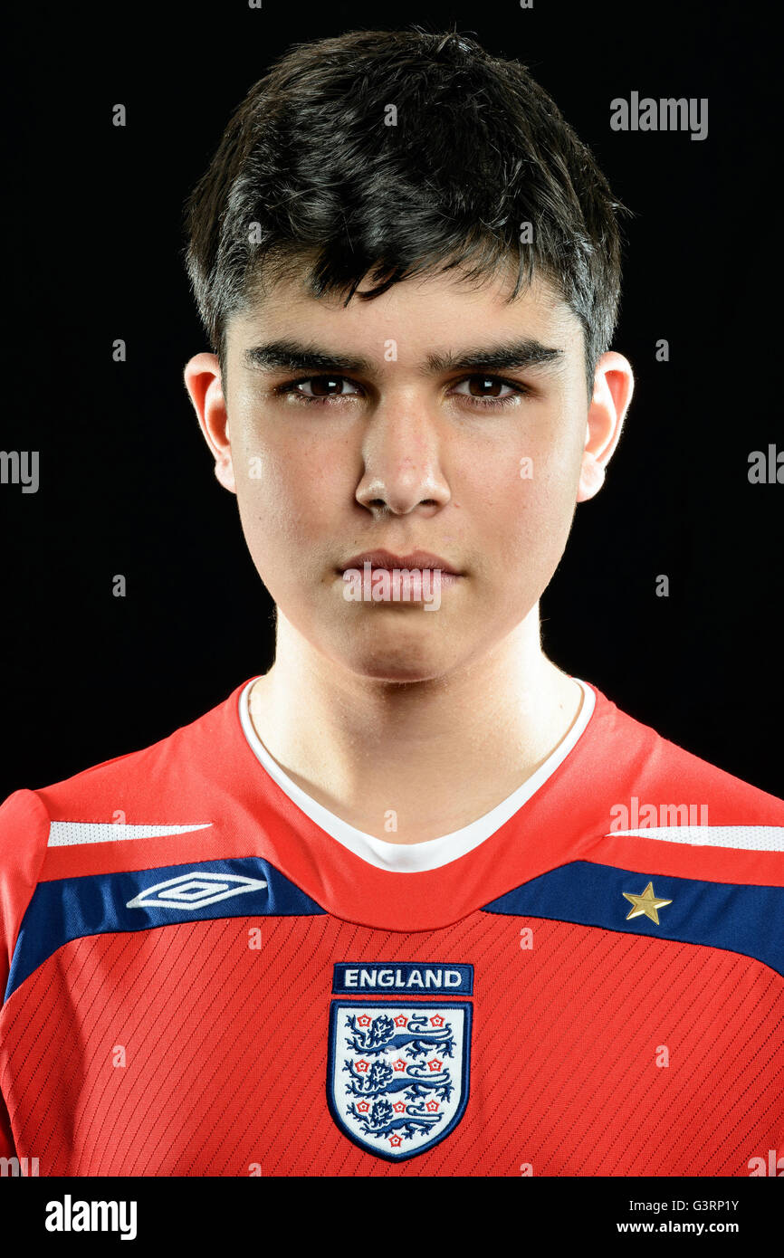 Teenage boy wearing England football shirt Stock Photo - Alamy