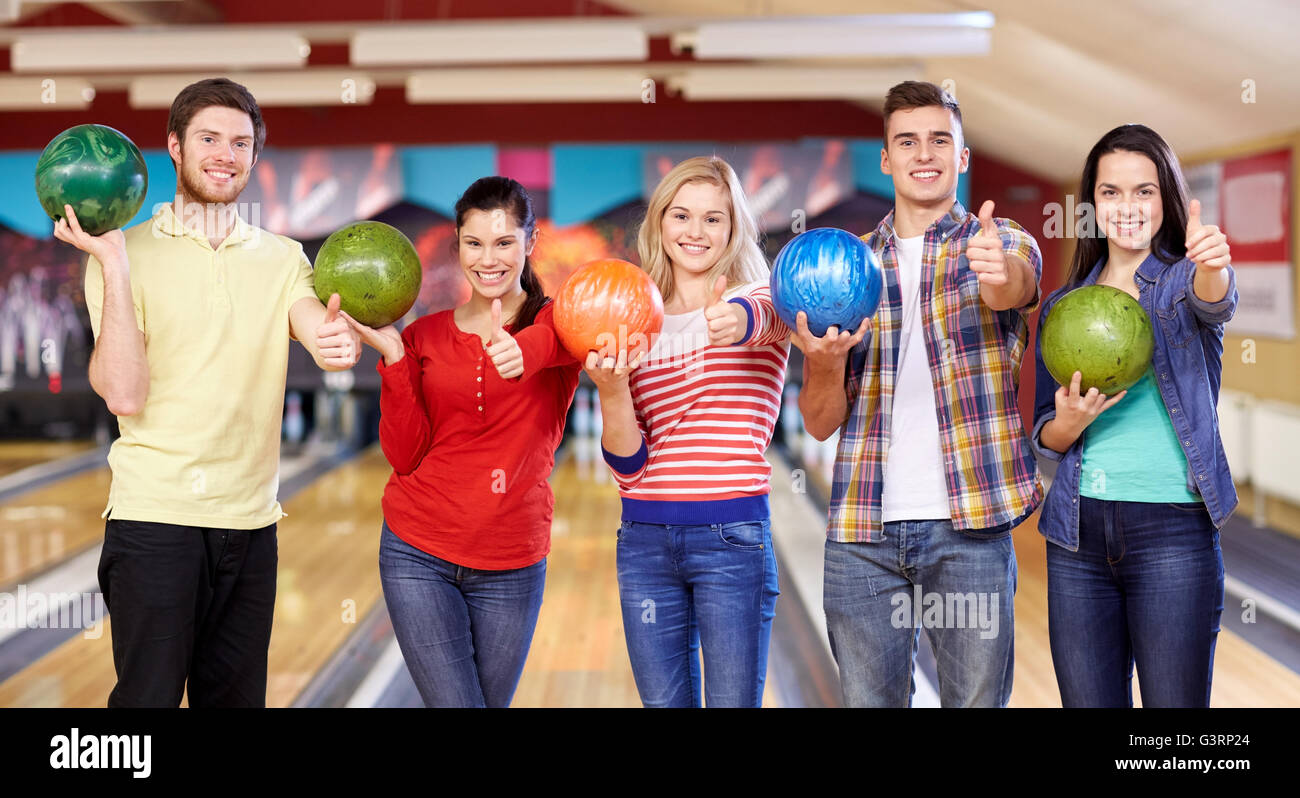 happy friends in bowling club Stock Photo - Alamy